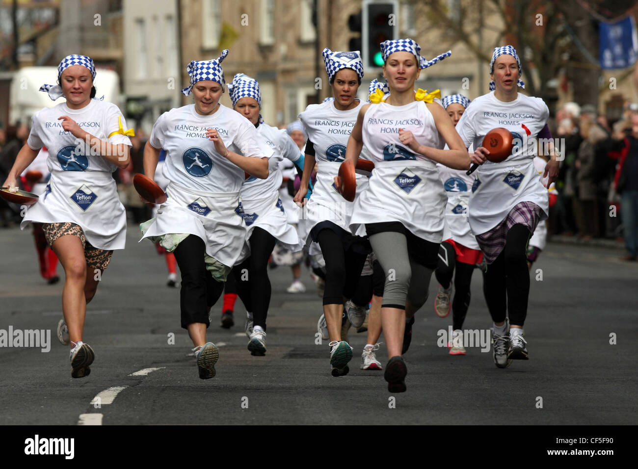 COMPETITORS IN THE WORLDS OLDEST PANCAKE RACE IN OLNEY,BUCKS ON FEB 21 ...