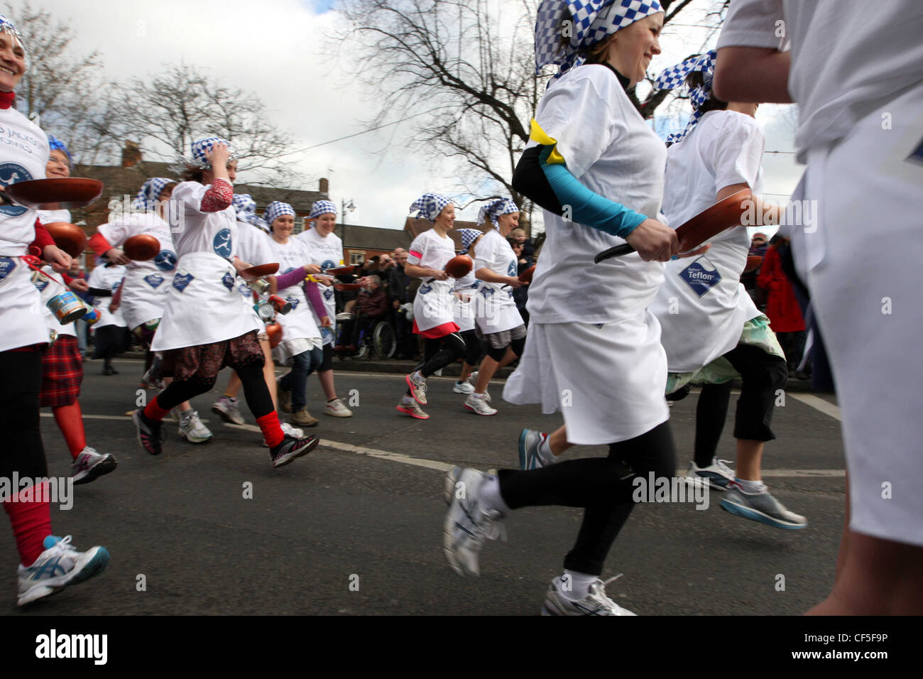 COMPETITORS IN THE WORLDS OLDEST PANCAKE RACE IN OLNEY,BUCKS ON FEB 21 ...
