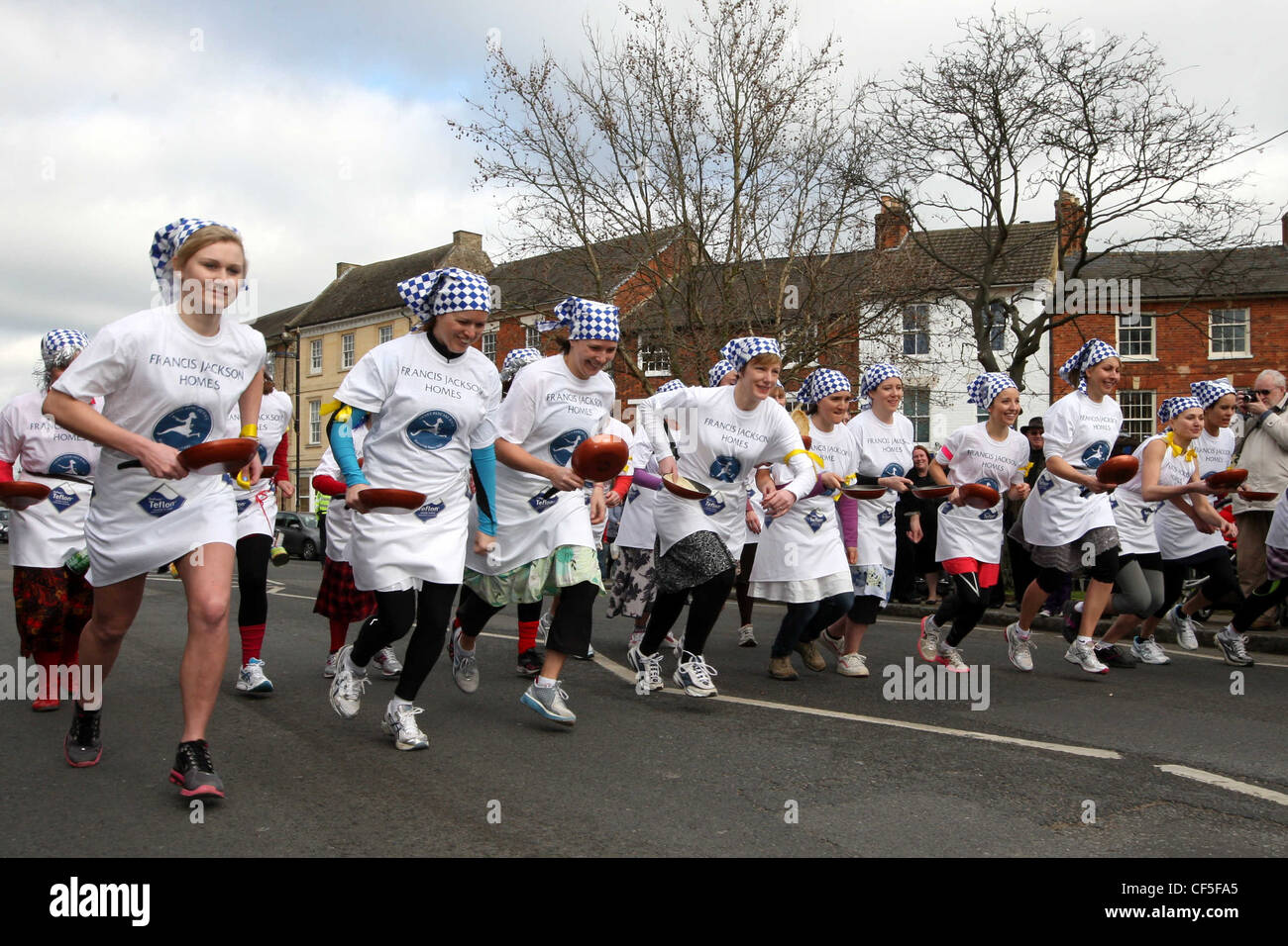 COMPETITORS IN THE WORLDS OLDEST PANCAKE RACE IN OLNEY,BUCKS ON FEB 21 ...