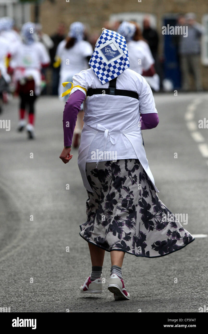 COMPETITORS IN THE WORLDS OLDEST PANCAKE RACE IN OLNEY,BUCKS ON FEB 21 ...