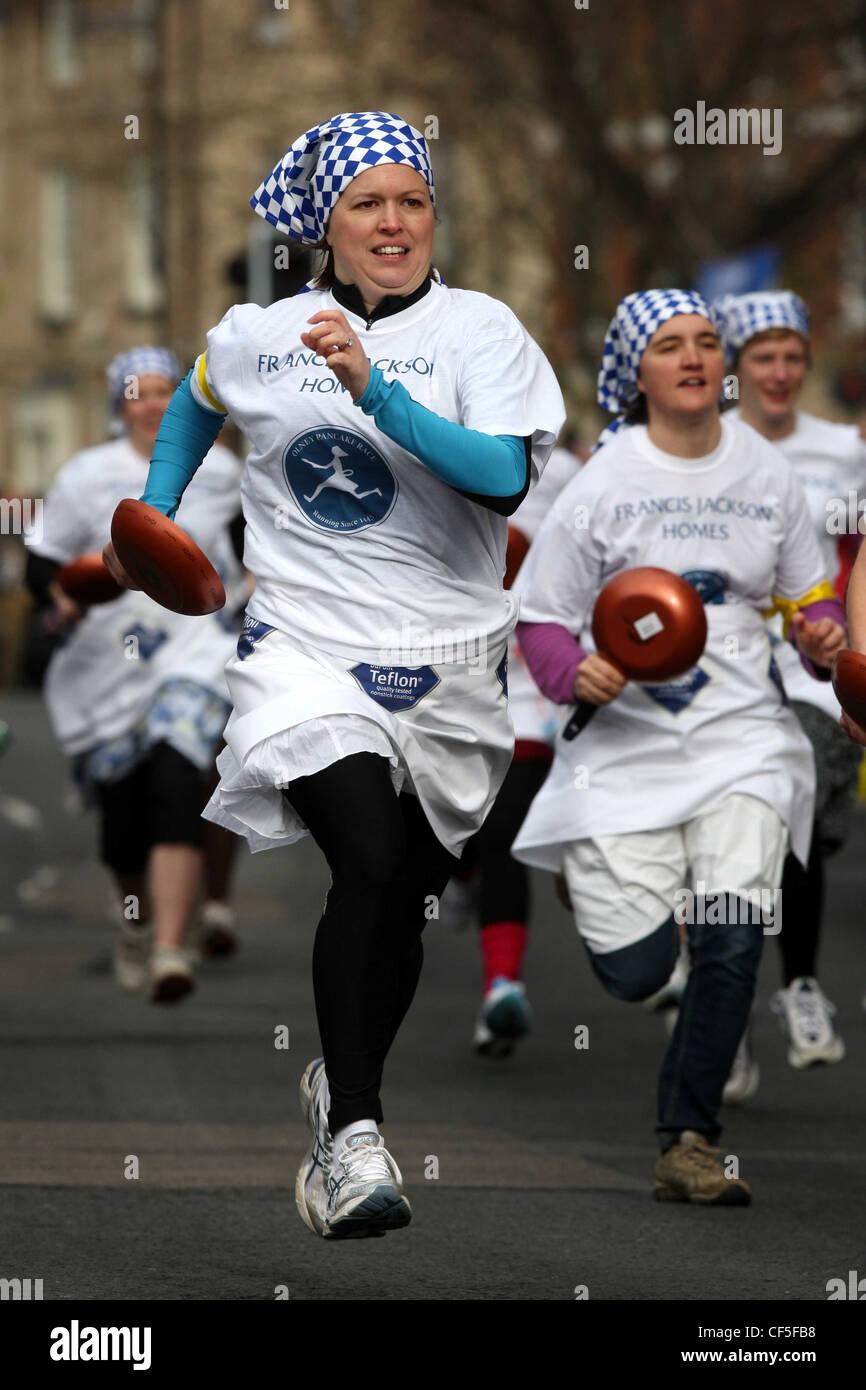 COMPETITORS IN THE WORLDS OLDEST PANCAKE RACE IN OLNEY,BUCKS ON FEB 21 ...