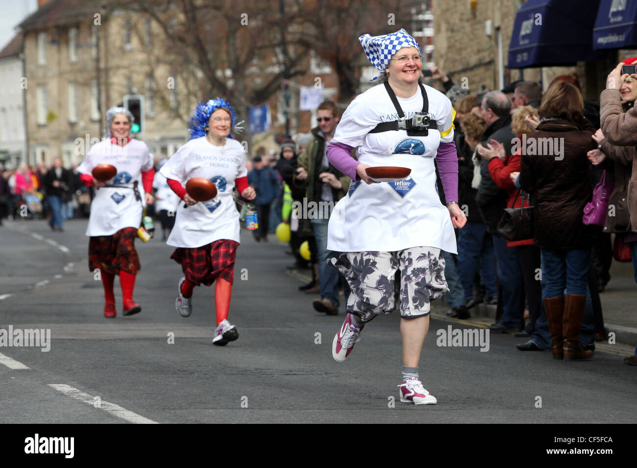 COMPETITORS IN THE WORLDS OLDEST PANCAKE RACE IN OLNEY,BUCKS ON FEB 21 ...