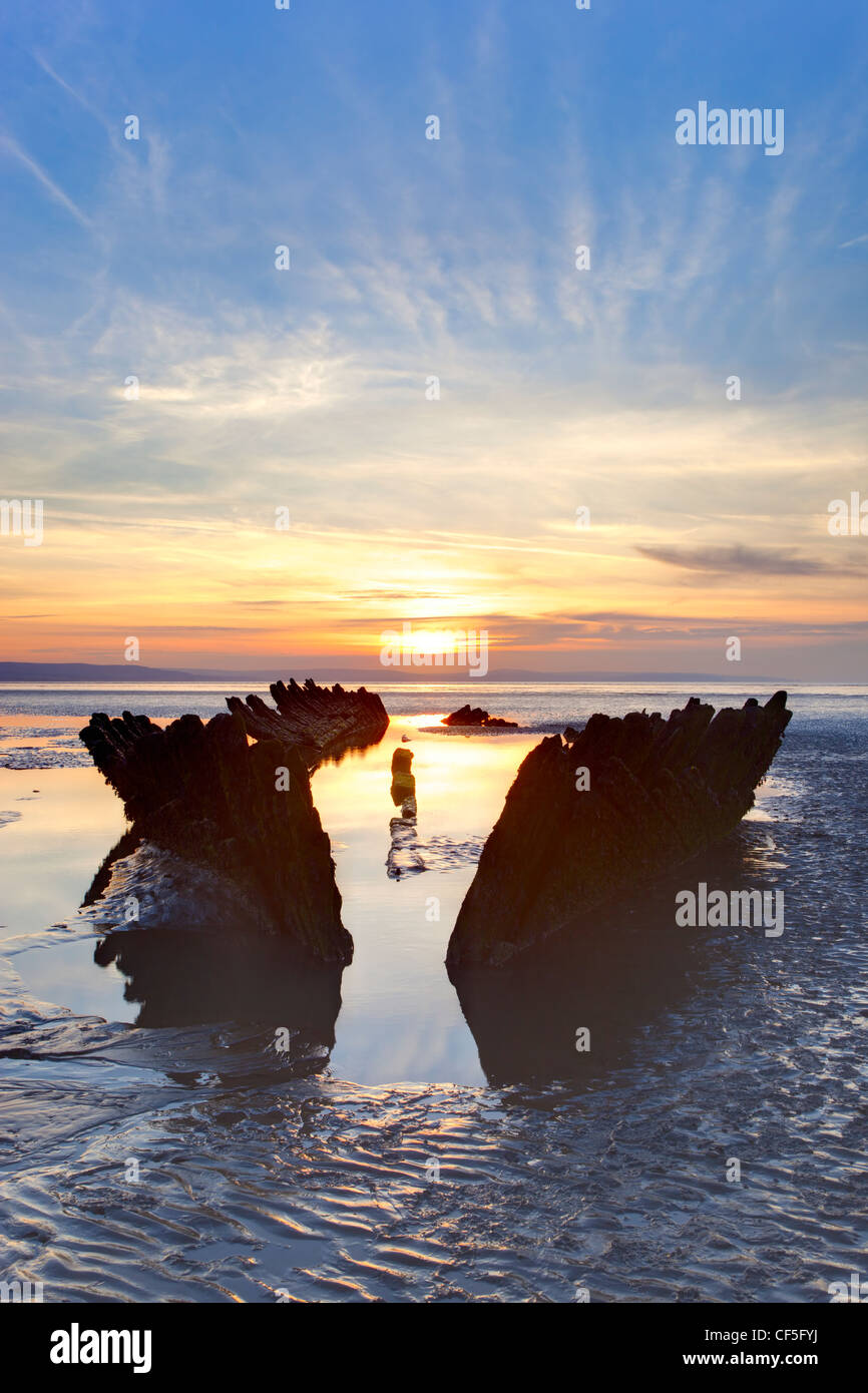 Sunset behind the wreck of the Norwegian barque SS Nornen which ran ...
