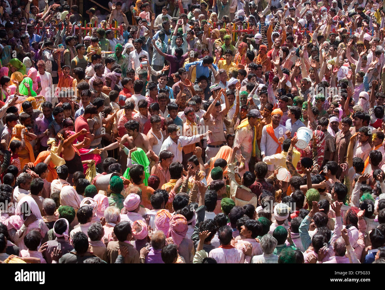 Crowds of people celebrate Holi festival in Mathura, India Stock Photo ...