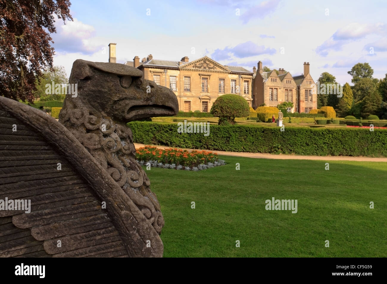 A statue of an eagle with an old building in the background Stock Photo ...