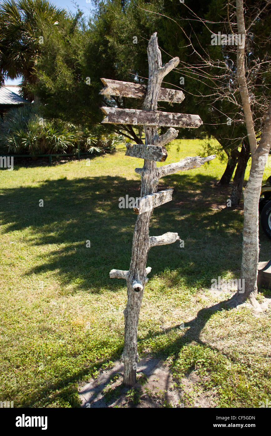 lichen covered wooden sign unreadable Stock Photo - Alamy