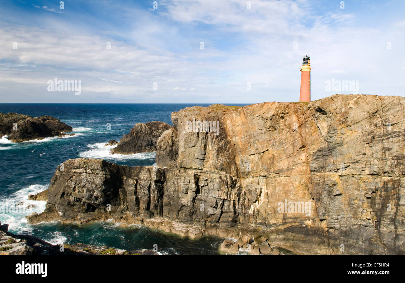 Waves crash against the cliff below the Butt of Lewis lighthouse Stock ...