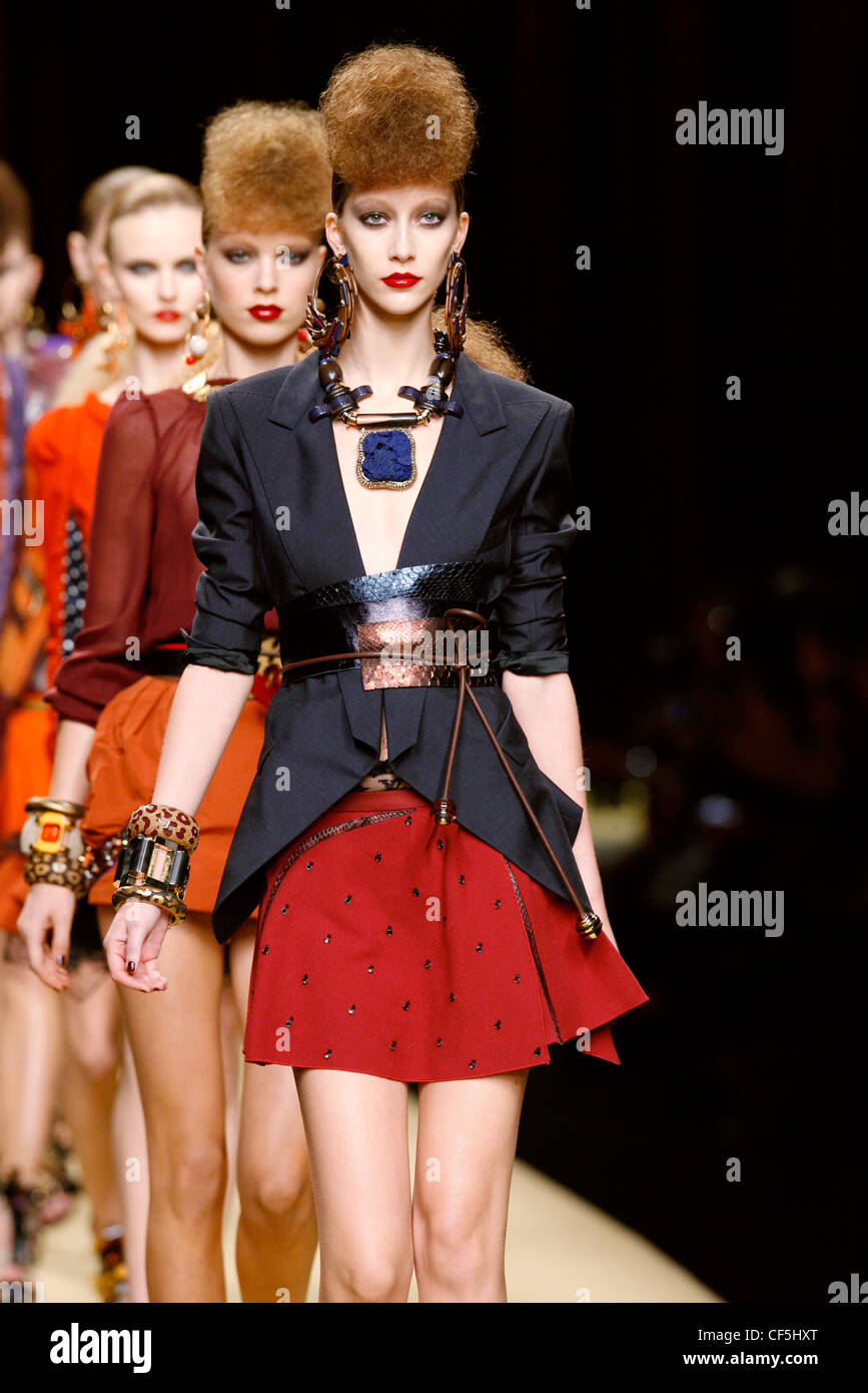 Model backcombed hair wearing a black jacket sleeves gathered above ...