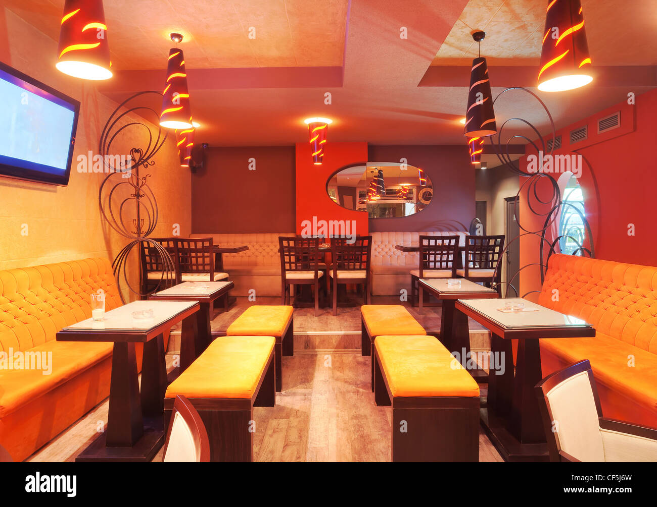 Interior of a restaurant, modern design in few colors, orange and brown ...
