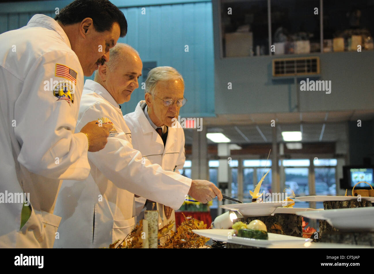 Culinary judges judge dishes and the display table prepared by the ...
