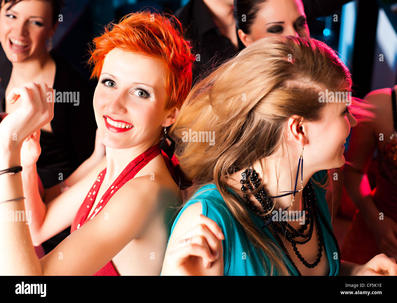 Happy girls dancing in nightclub hi-res stock photography and images ...