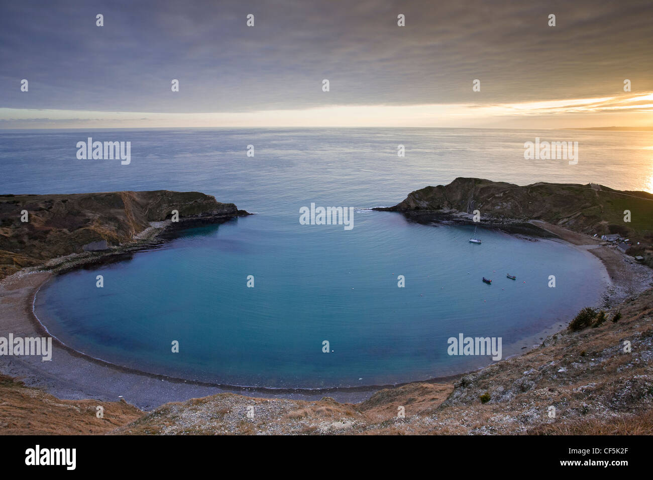 View down to Lulworth Cove, a unique horseshoe shaped cove formed by ...