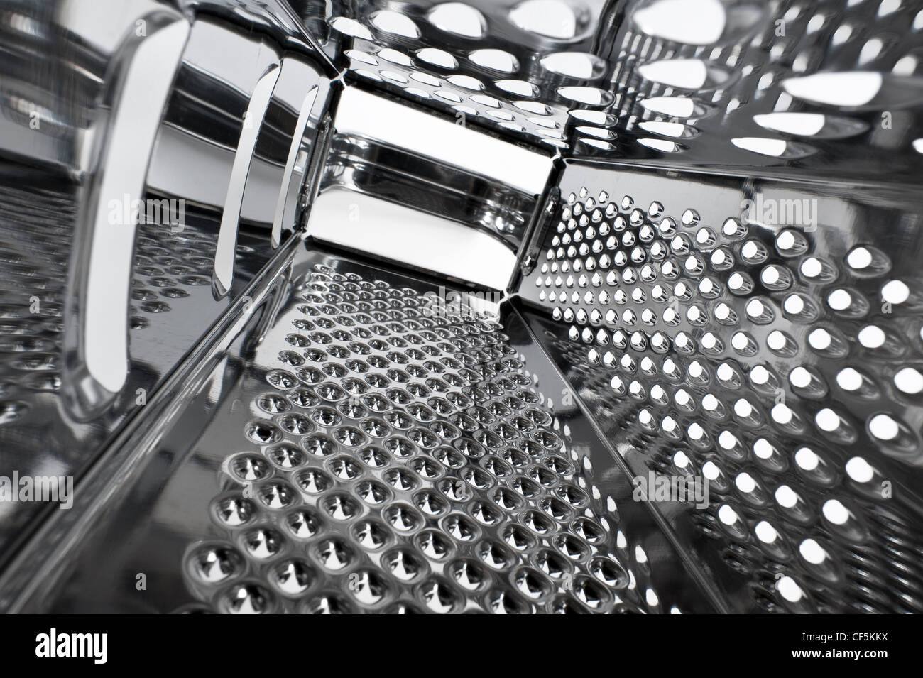 close up of metal food cheese grater stainless steel highly reflective ...
