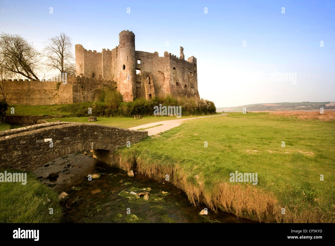 Laugharne Castle in Wales. The castle stands on a low cliff by the side ...