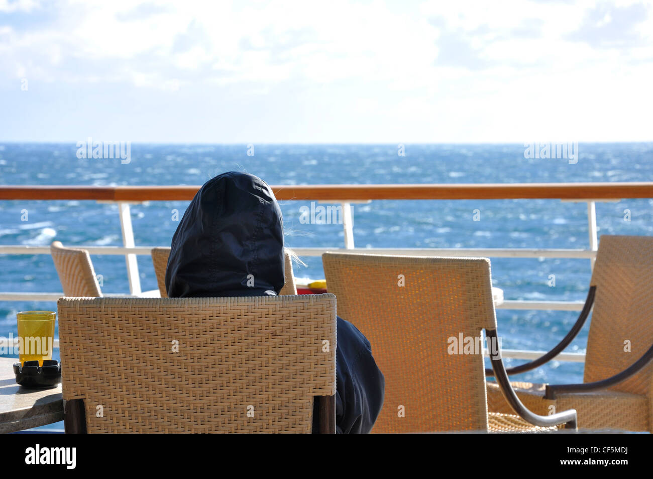 Man on cruise ship deck Stock Photo - Alamy
