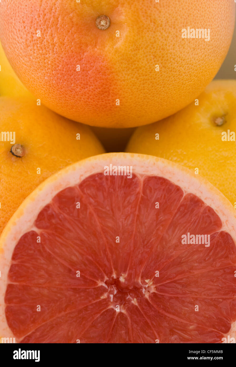 A close up image of grapefruits with one grapefruit halved Stock Photo ...