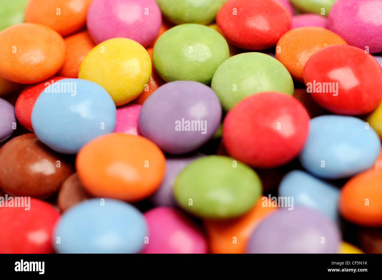 Multi coloured sugar coated chocolate Stock Photo - Alamy