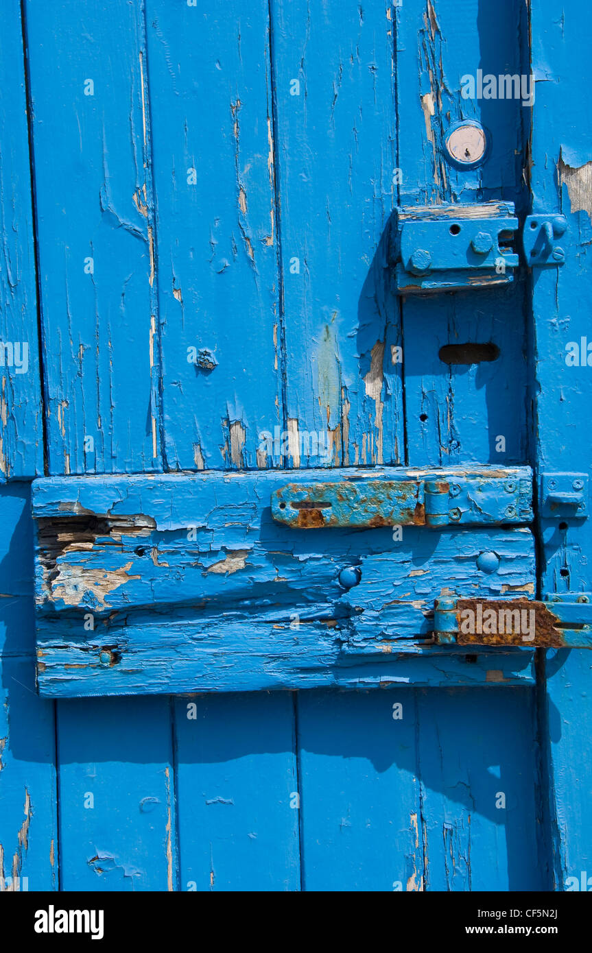 Old rotting blue wooden door with peeling paint Stock Photo - Alamy