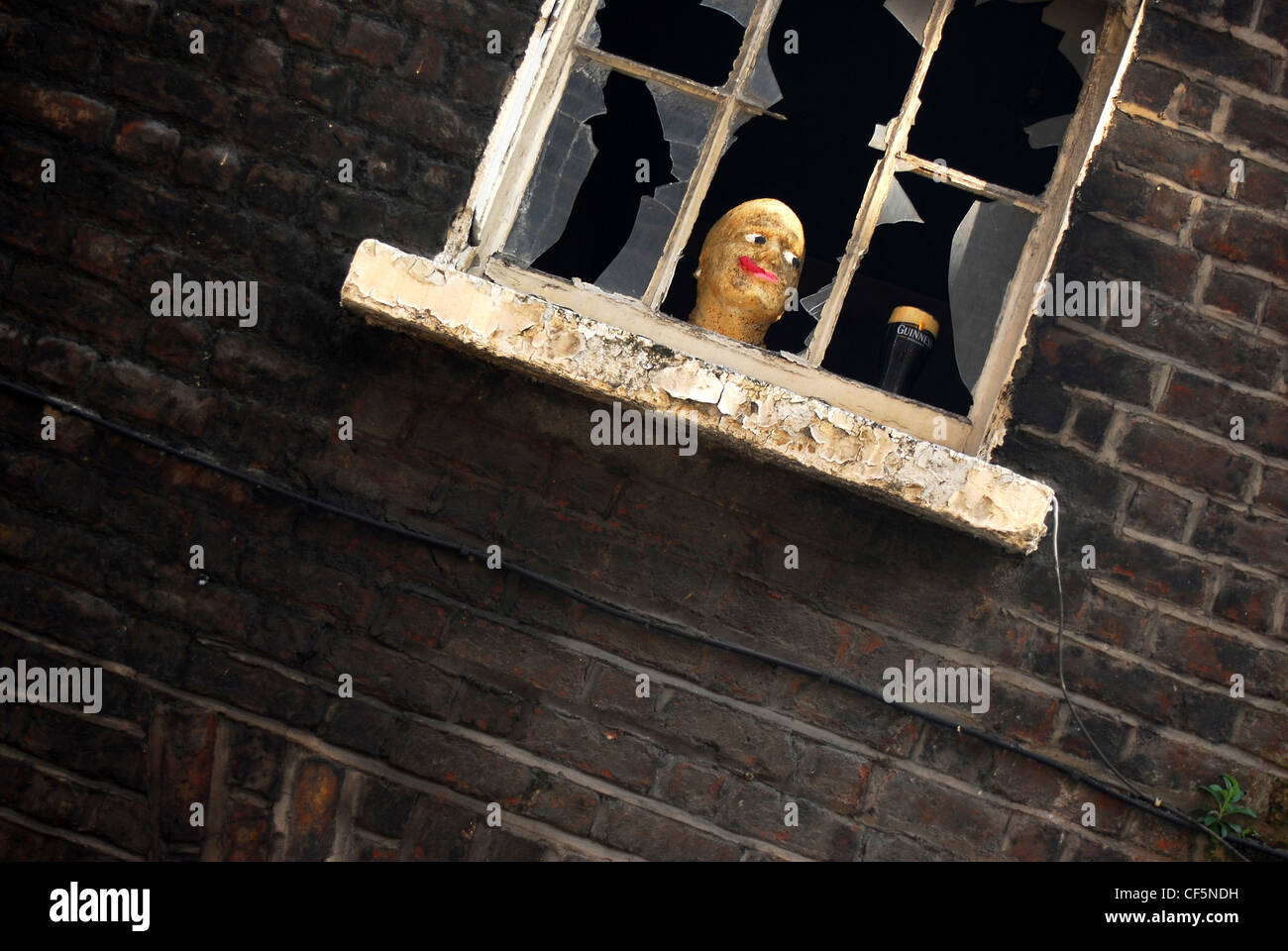 A broken window overlooking the Guinness Storehouse in Dublin Stock ...