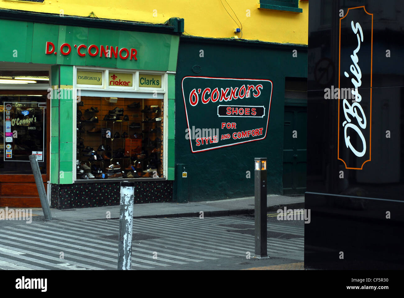Shop signs from a street scene in central Cork Stock Photo - Alamy