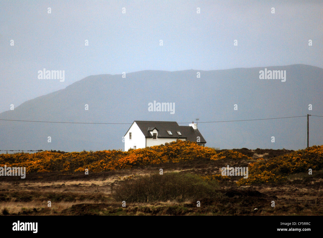 A view toward a lone farmhouse and mountains near Doo Lough in County ...