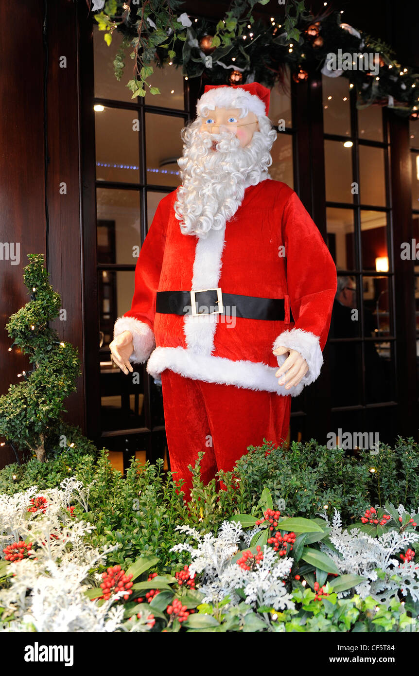 Detail image of a Santa Claus in front of a restaurant in London Stock ...