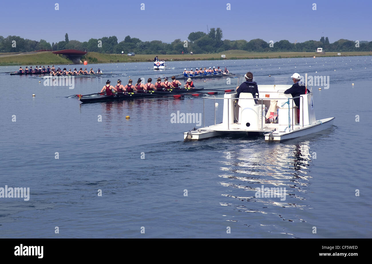 Crews of eight pass a referees boat in a a race at Eton Dorney, the ...