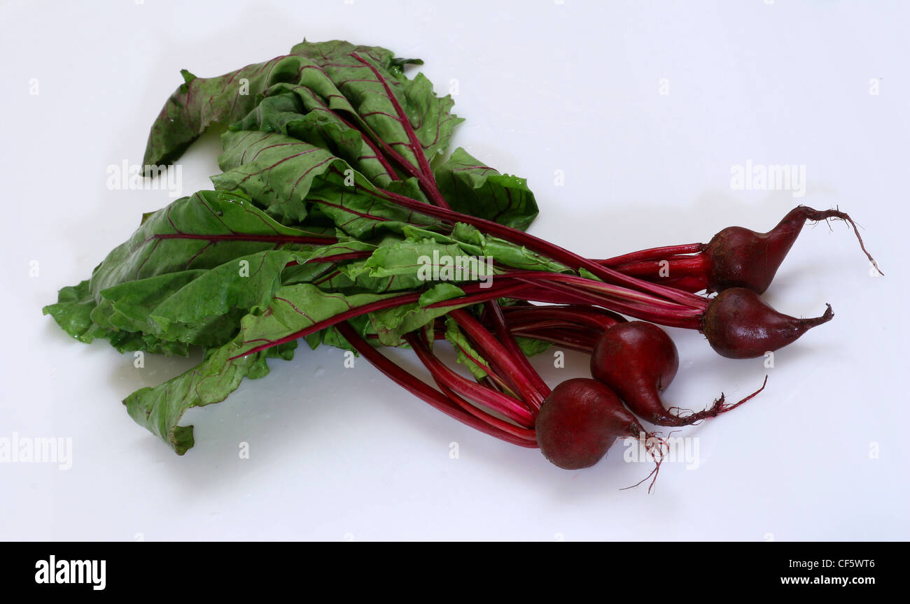A small pile of fresh beetroots with their leaves still attach Stock ...