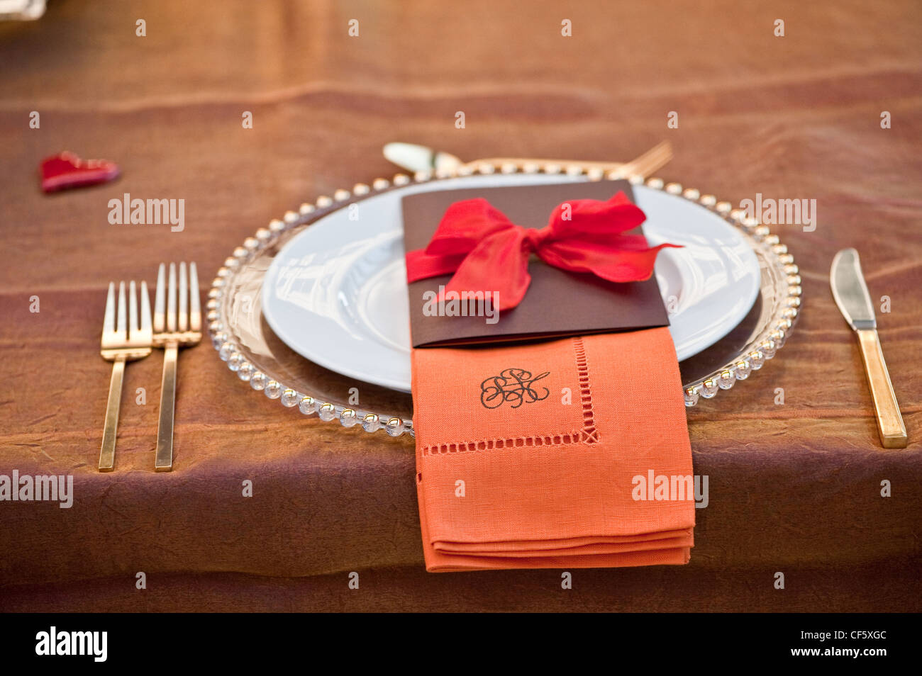 An elegant plate set on a table Stock Photo - Alamy