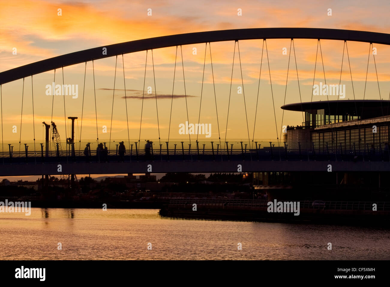 Outline of Salford Quays Millennium Bridge at sunset Stock Photo - Alamy