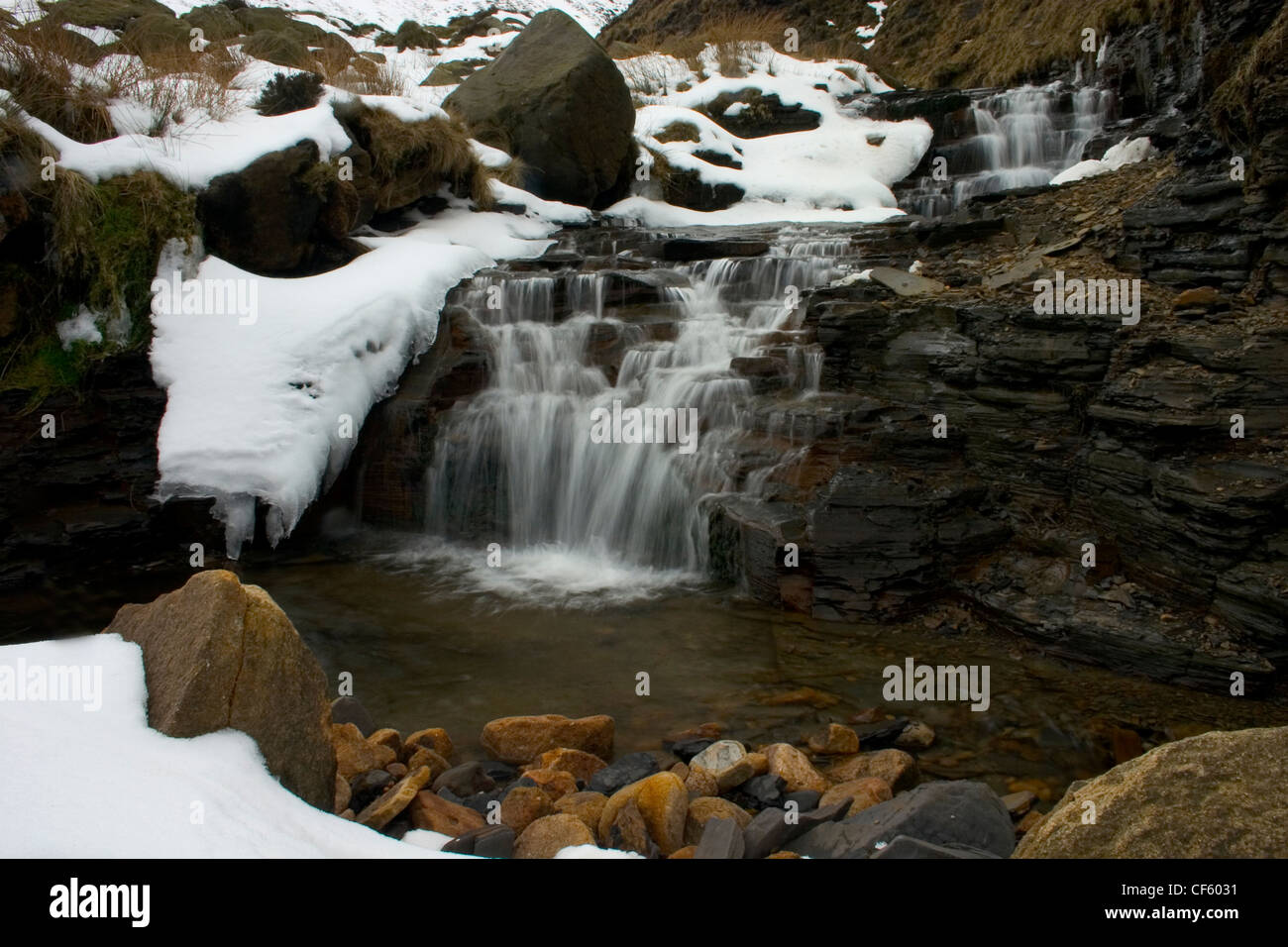 One of the many small waterfalls along Grindsbrook Clough Stock Photo ...