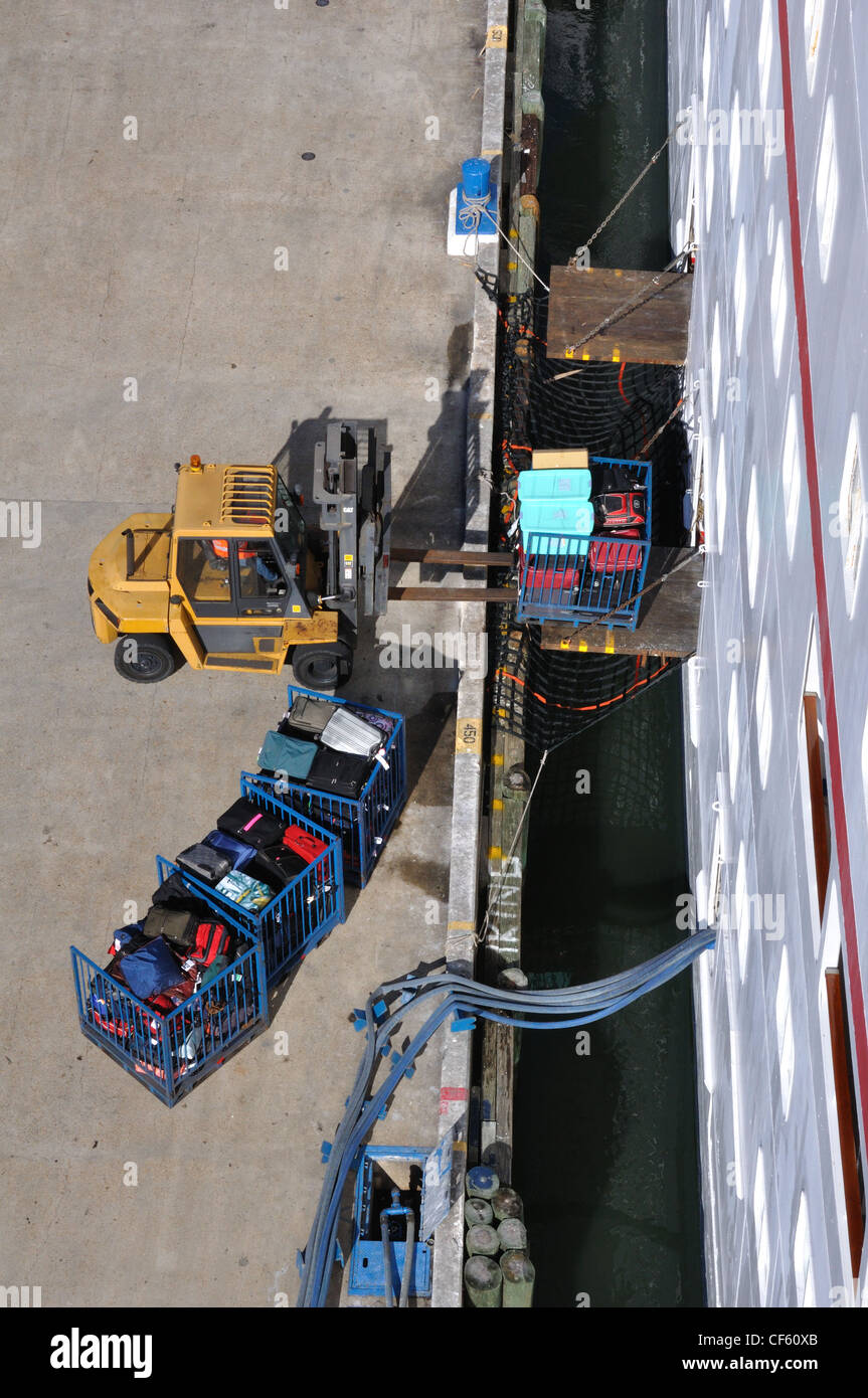 Loading passengers' luggage on cruise ship Stock Photo - Alamy