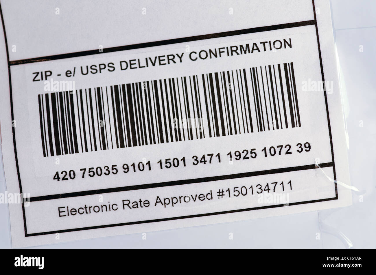 Delivery confirmation sticker on envelope Stock Photo - Alamy