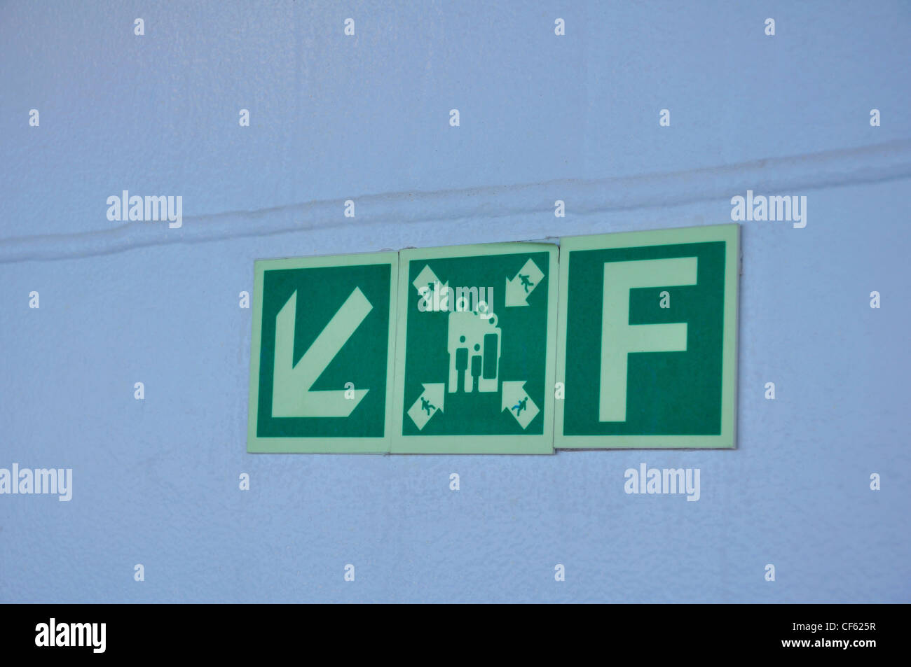 Emergency exit sign and directions to lifeboat on cruise ship Stock ...
