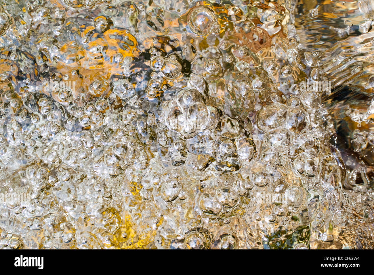 Pure mountain stream water creating crystal-like bubbles Stock Photo ...