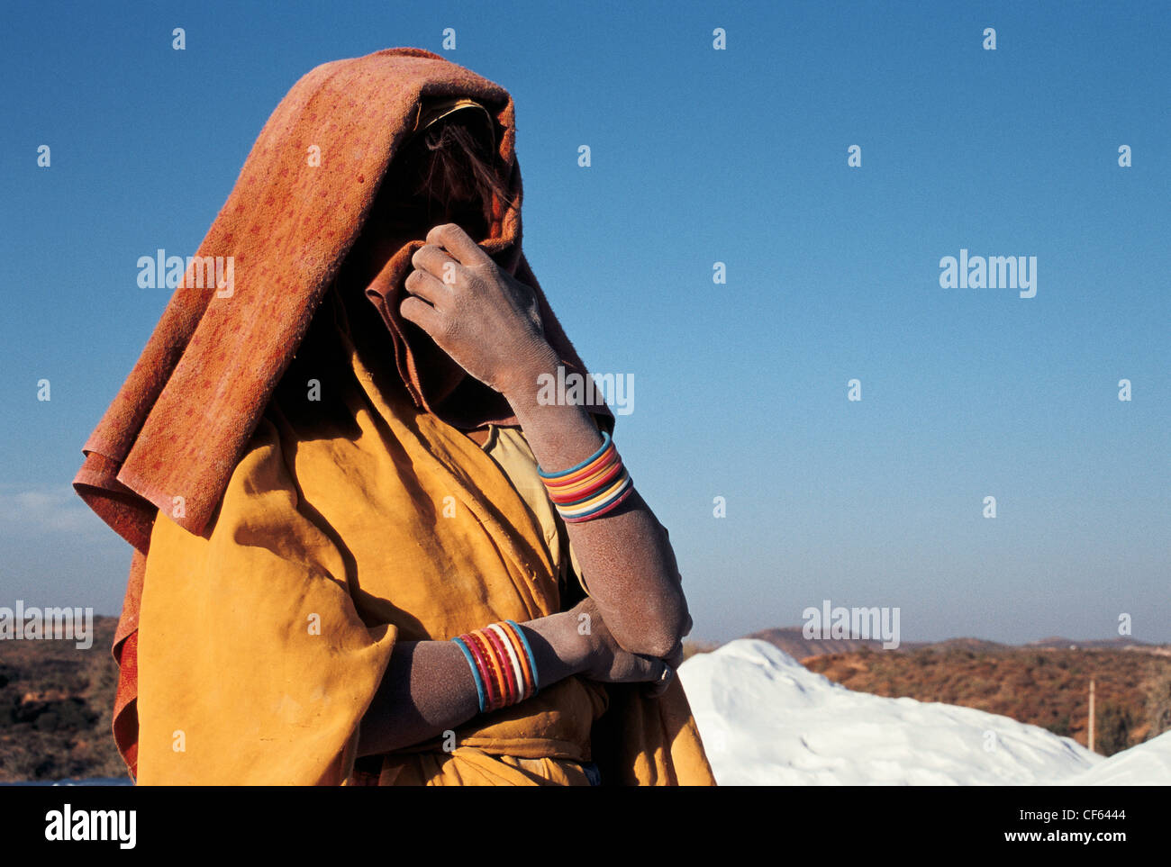 Shy tribal woman working in a gypsum quarry ( India Stock Photo - Alamy