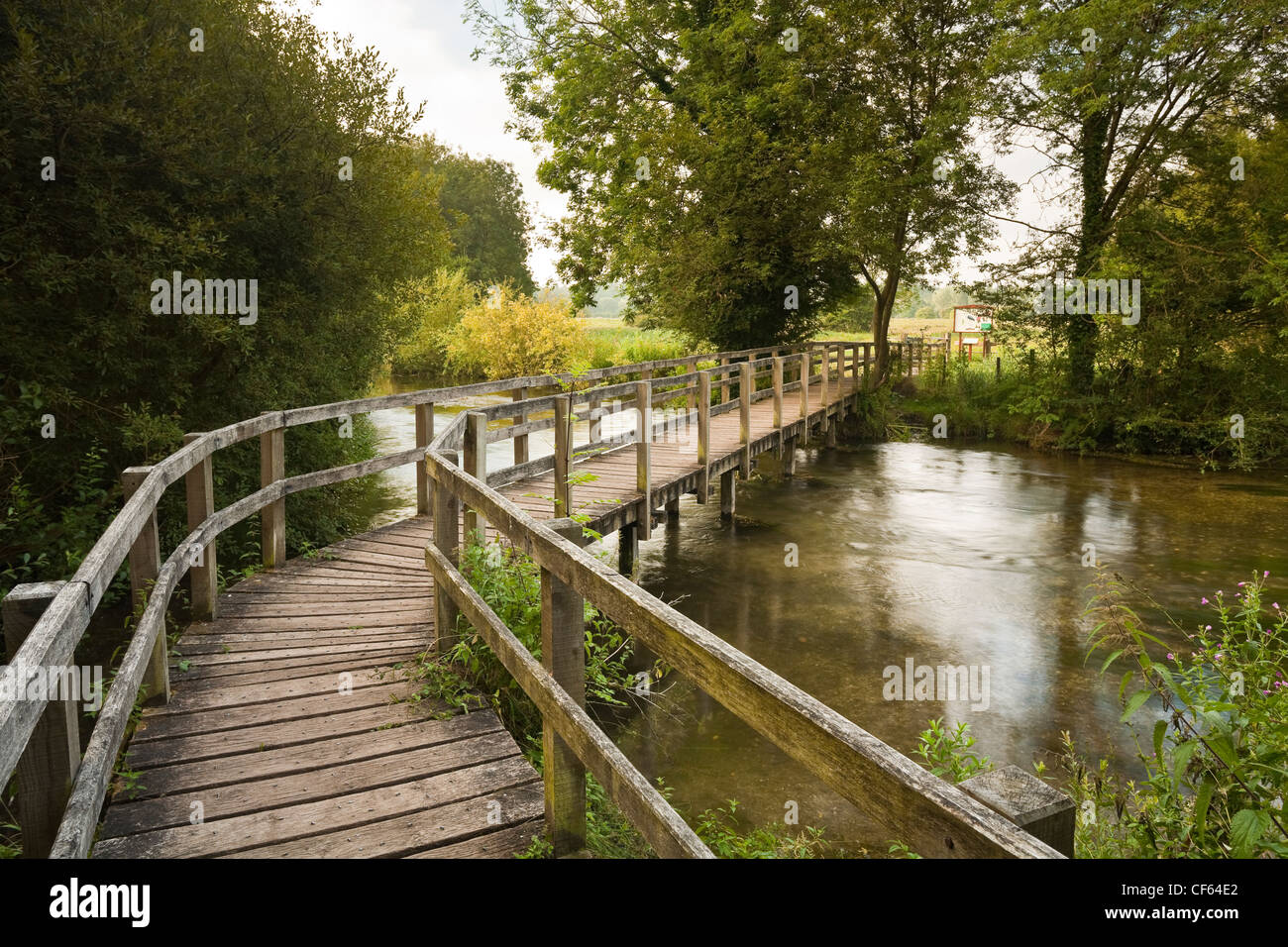 A wooden footbridge over the River Test leading to Chilbolton Cow ...