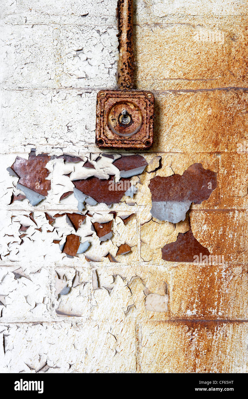 Decrepit wall light switch. The direction of the switch that means "on ...