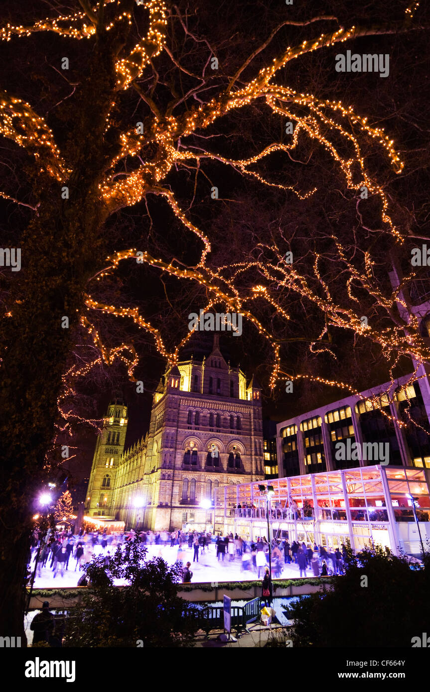 People enjoying an ice skating rink outside the Natural History Museum ...