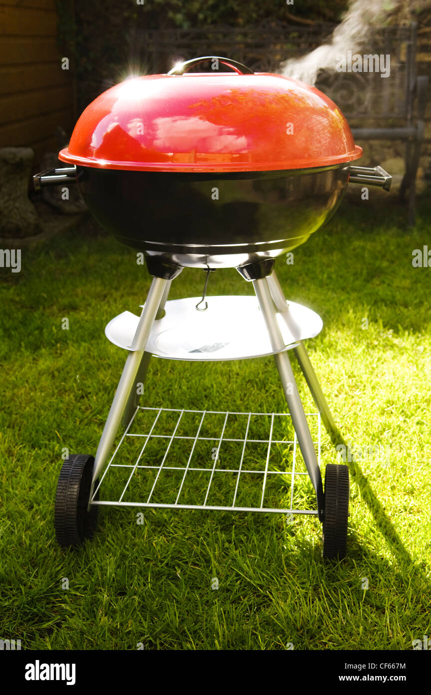 A portable barbeque in a garden Stock Photo - Alamy