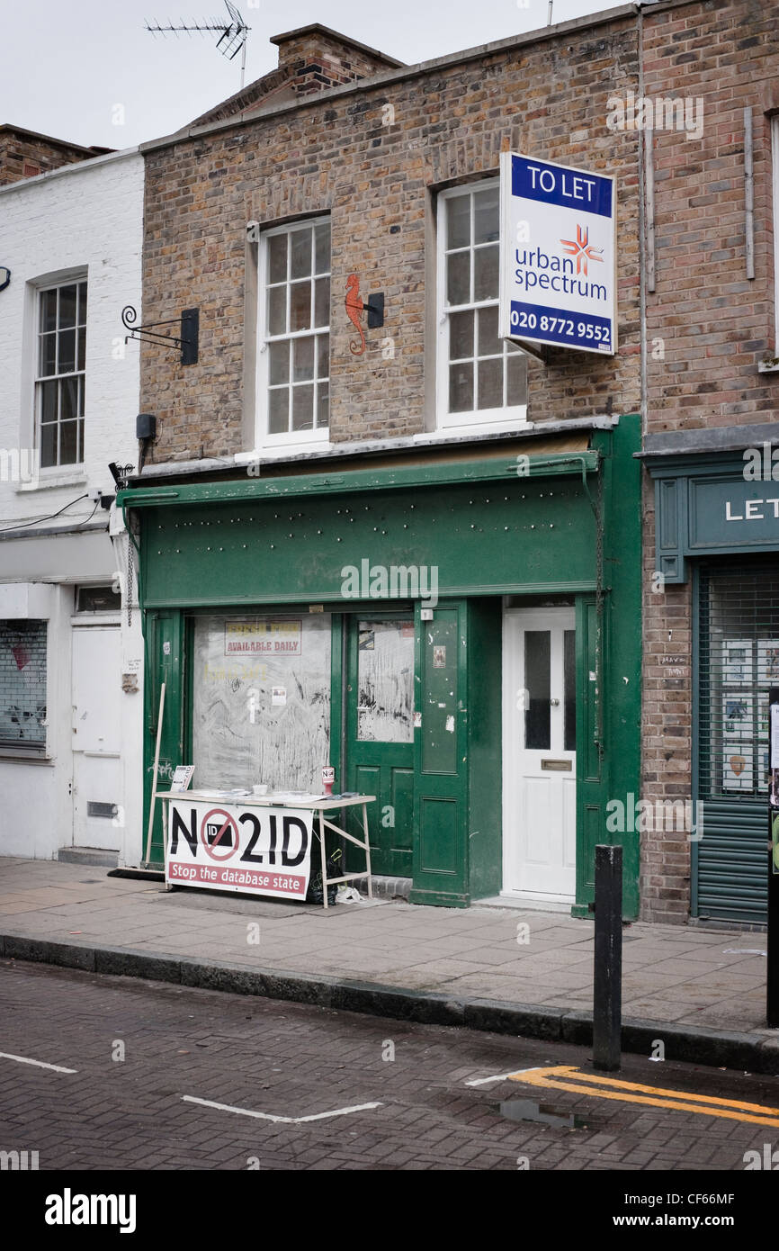 No to National ID cards stand in front of a boarded up shop Stock Photo ...