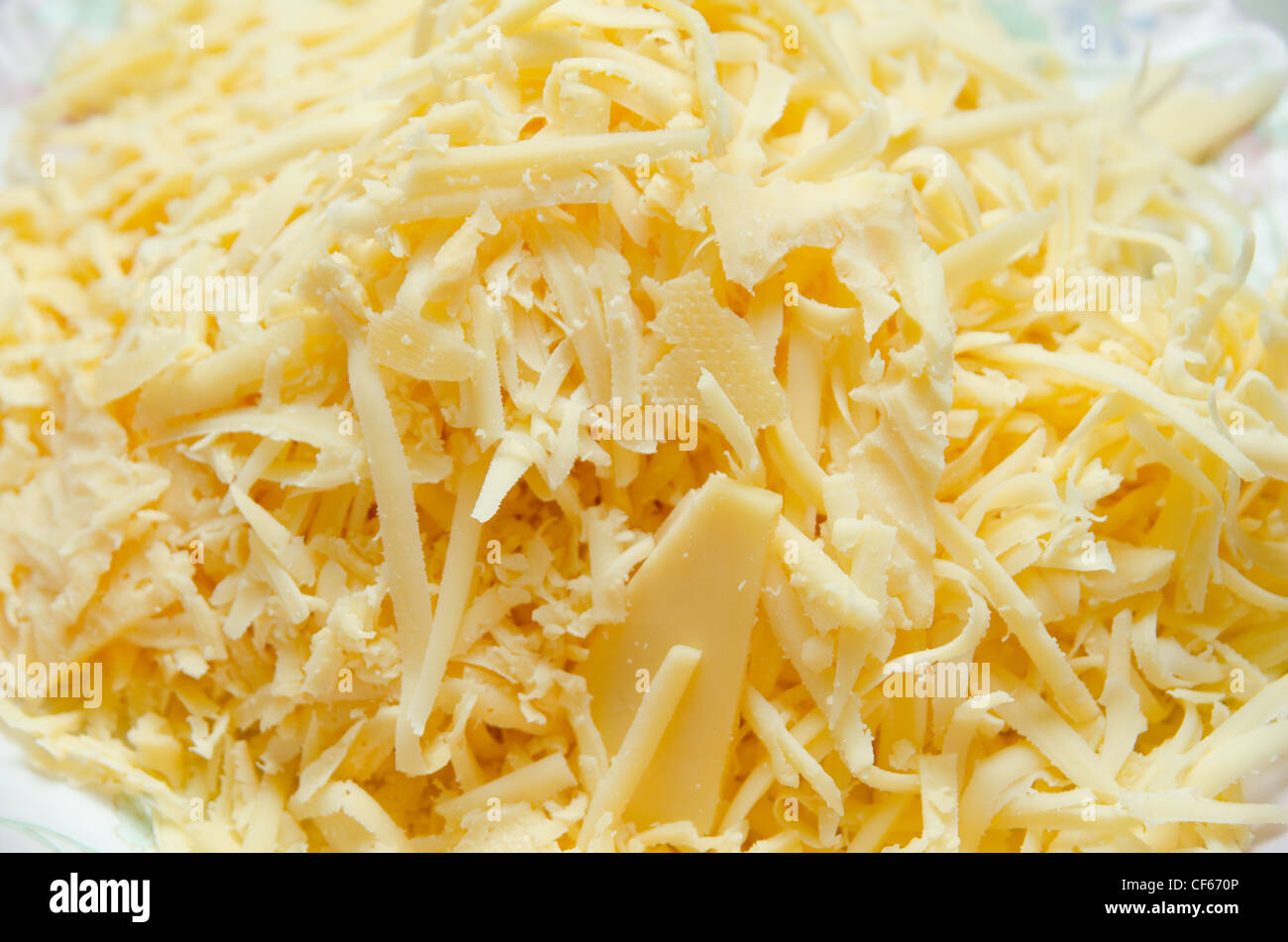 grated cheese at plate Stock Photo - Alamy