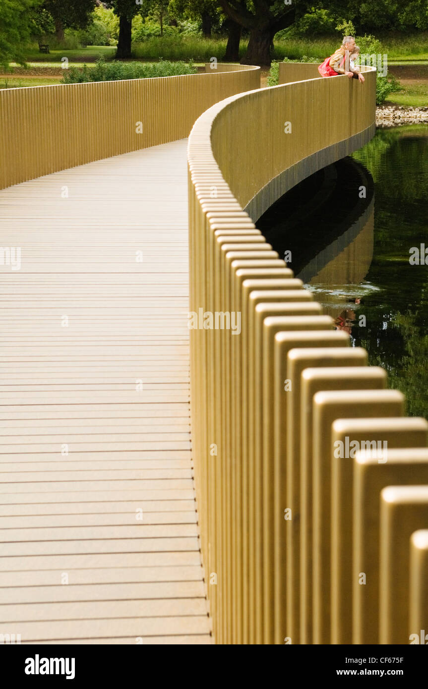 View along the Sackler Crossing over the Lake in Kew Gardens. The ...