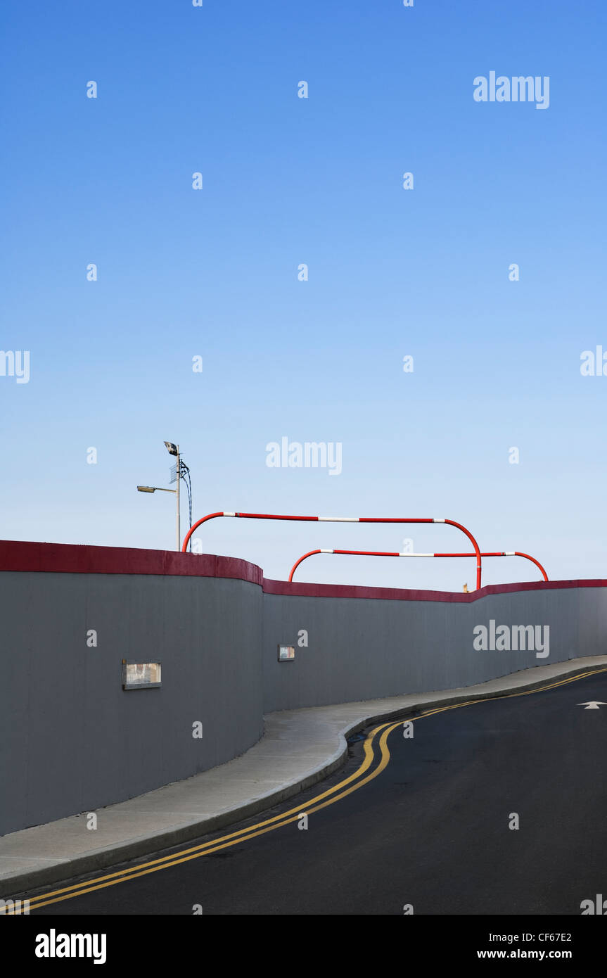 Construction site boarding along a winding road Stock Photo - Alamy