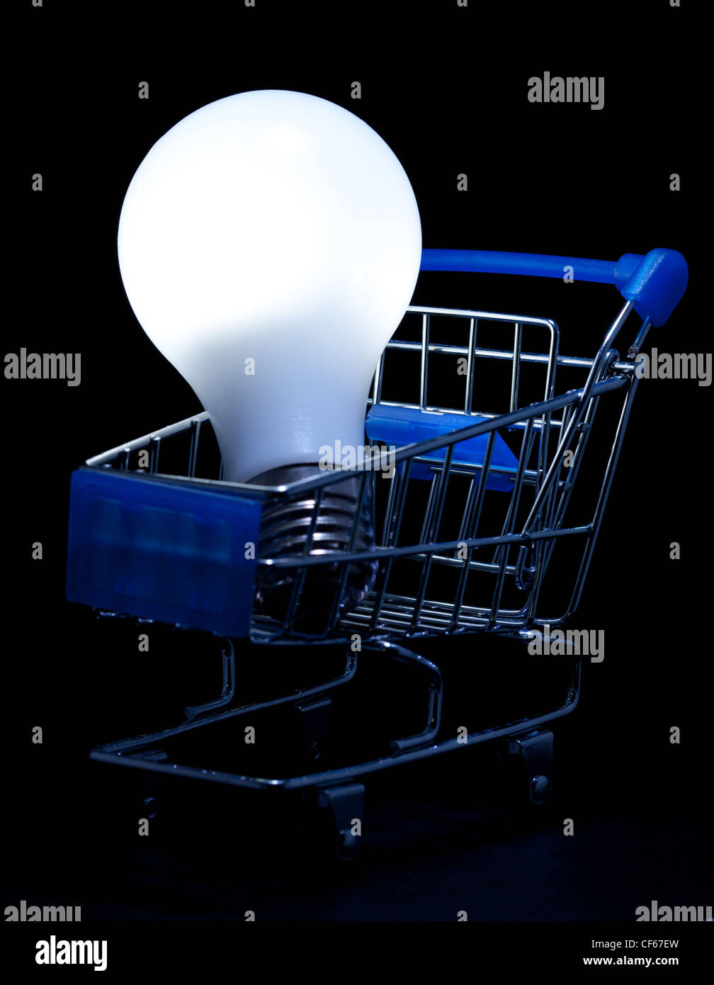 Shopping cart with lightning light bulb on black background Stock Photo ...