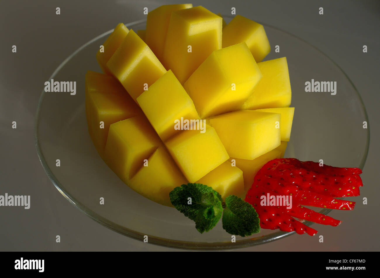 Mango with section on a white background Stock Photo - Alamy
