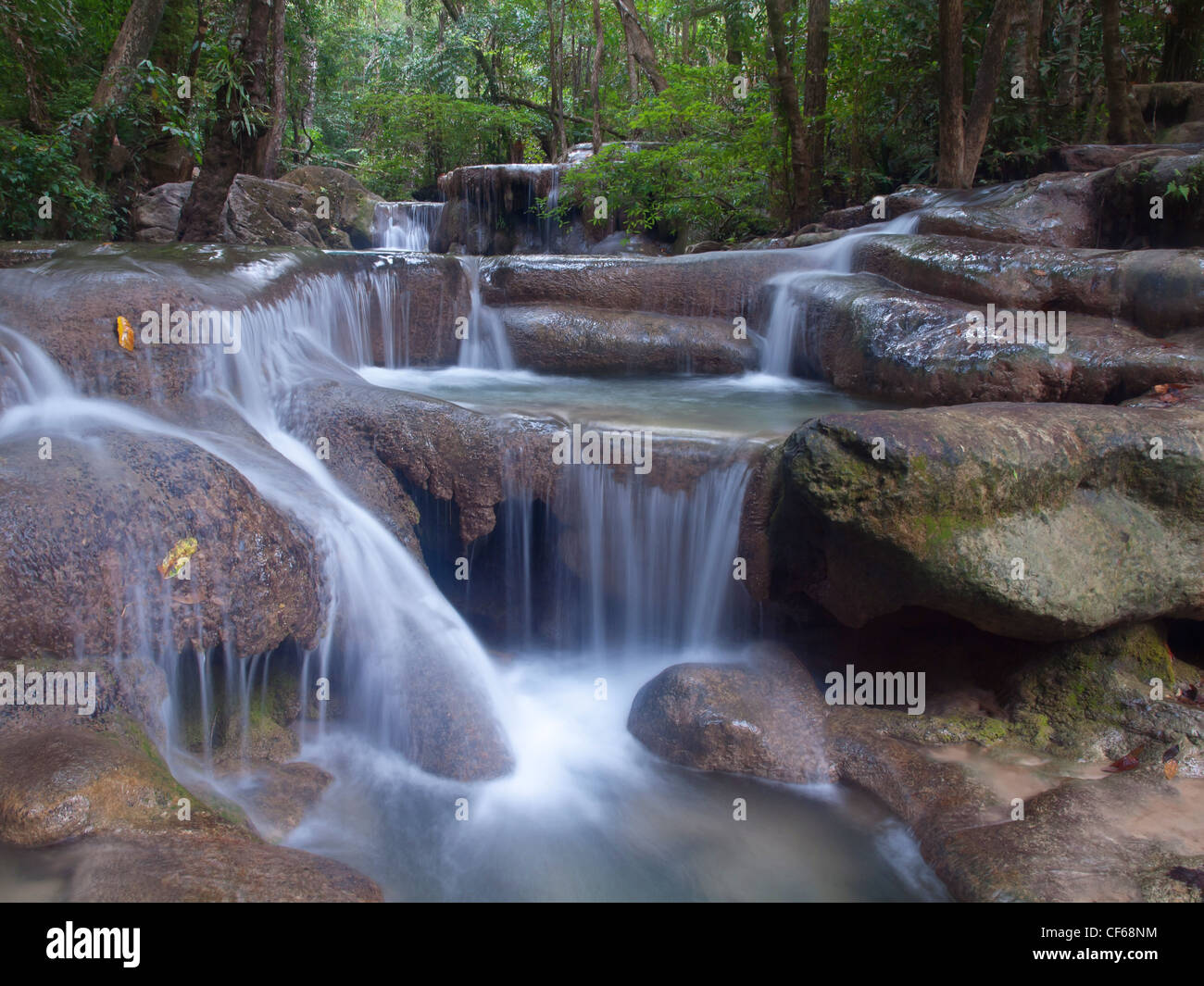 Erawan waterfall with emerald color water Stock Photo - Alamy
