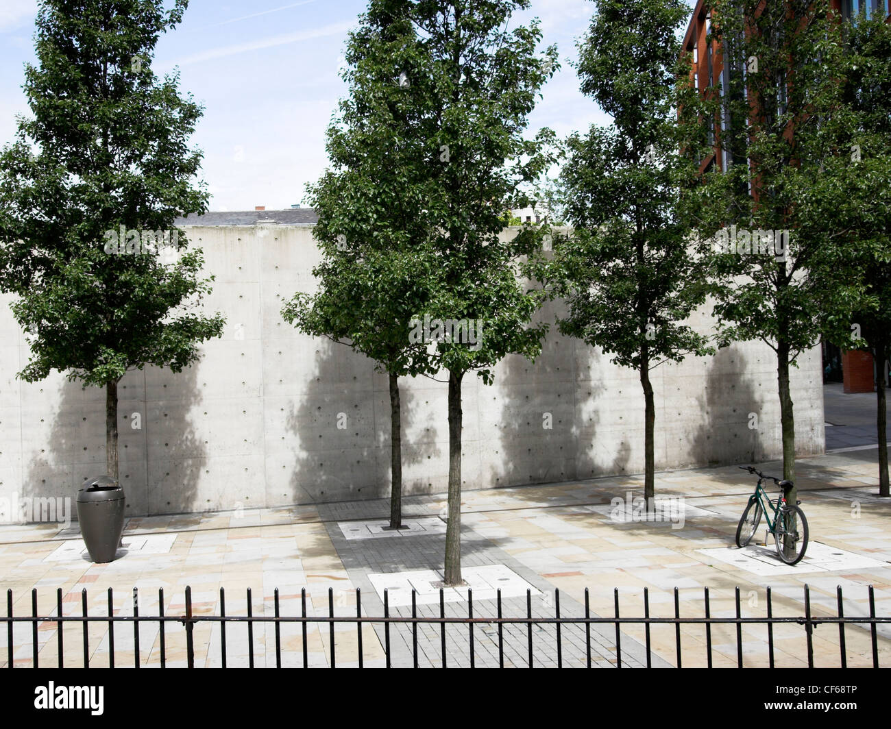 Trees in a pedestrian area of Manchester city centre. Millions of ...