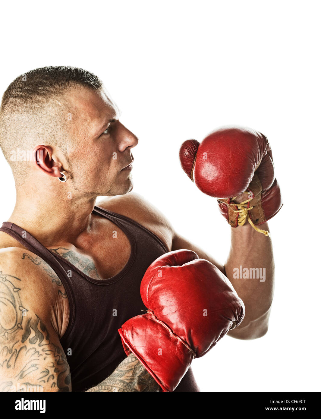 muscular young man in boxing gloves, ready to fight Stock Photo - Alamy