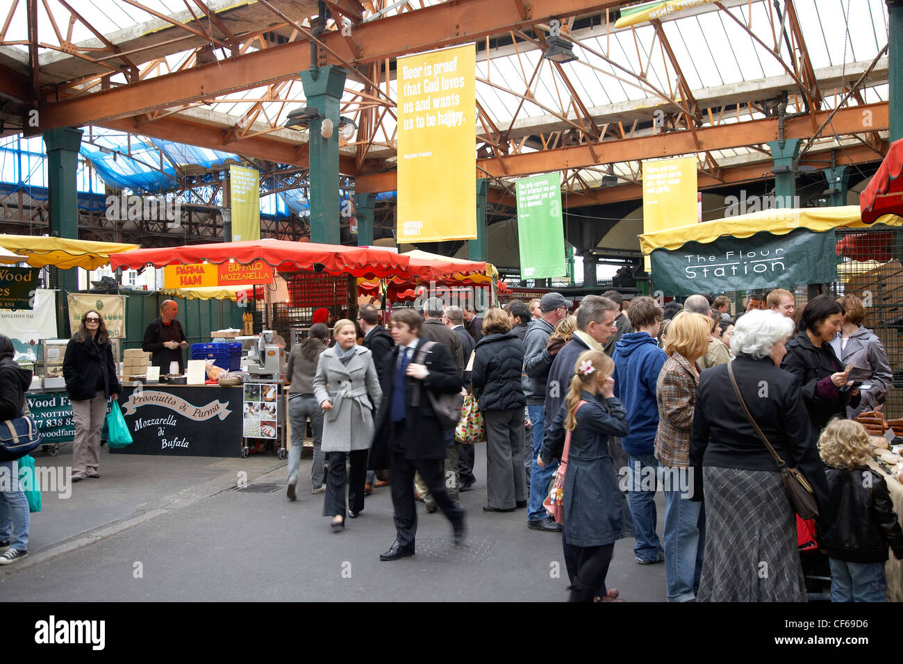 An interior view of stalls and customers at Borough Market Stock Photo ...